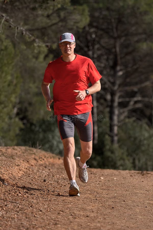 Young Runner Running in Red T-shirt at Springtime Stock Photo - Image ...