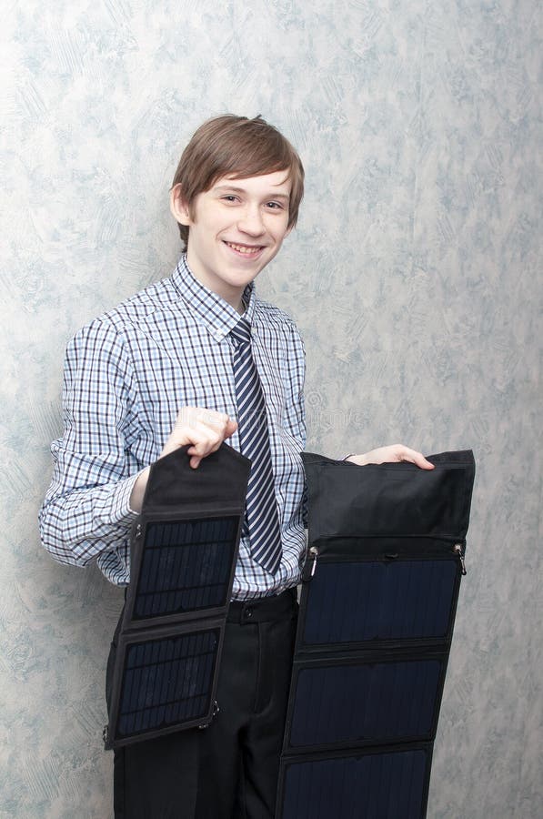 The Young Russian Guy Holds the Solar Panel in Hand Stock Image - Image ...