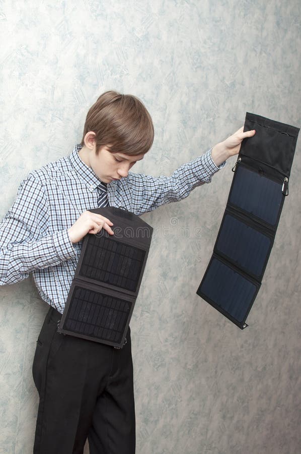 The Young Russian Guy Holds the Solar Panel in Hand Stock Photo - Image ...