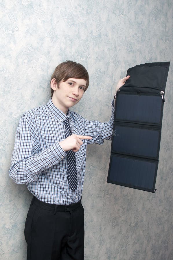 The Young Russian Guy Holds the Solar Panel in Hand Stock Photo - Image ...