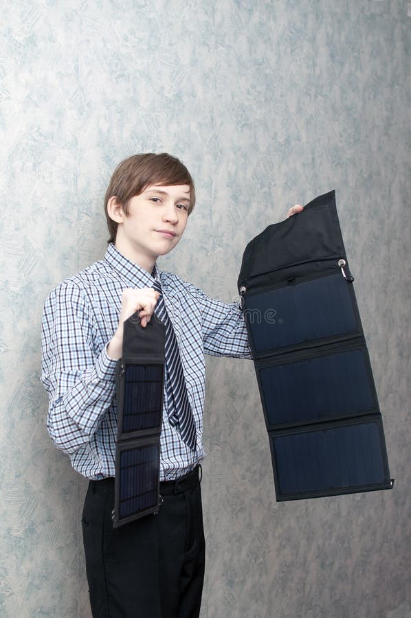 The Young Russian Guy Holds the Solar Panel in Hand Stock Photo - Image ...