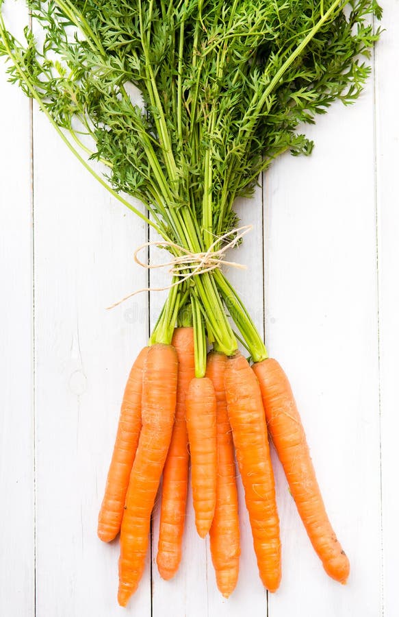 Young Rustic Carrots on White Boards Stock Image - Image of dirt ...