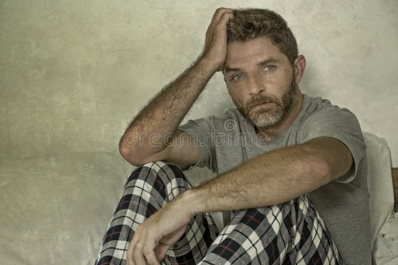 Young Sad and Depressed Man Lying Thoughtful and Pensive on Bed Looking ...