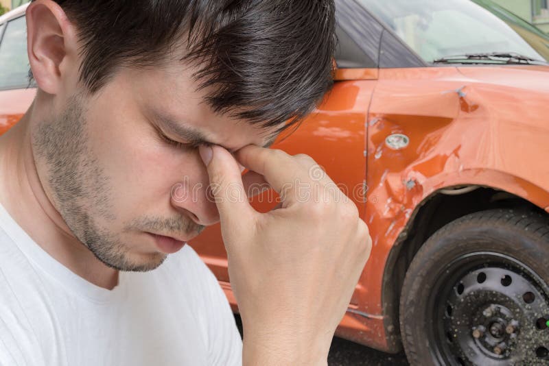 Unhappy Sad Driver Had Car Accident. Destroyed Car in Background Stock ...