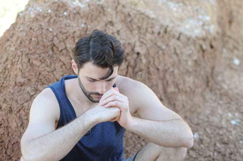 Young Sad Praying Man Portrait Stock Photo - Image of loneliness ...