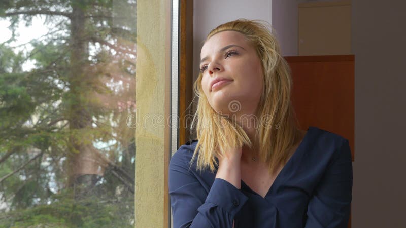 Young Attractive Bored Woman Waiting and Looking Out the Window Stock ...