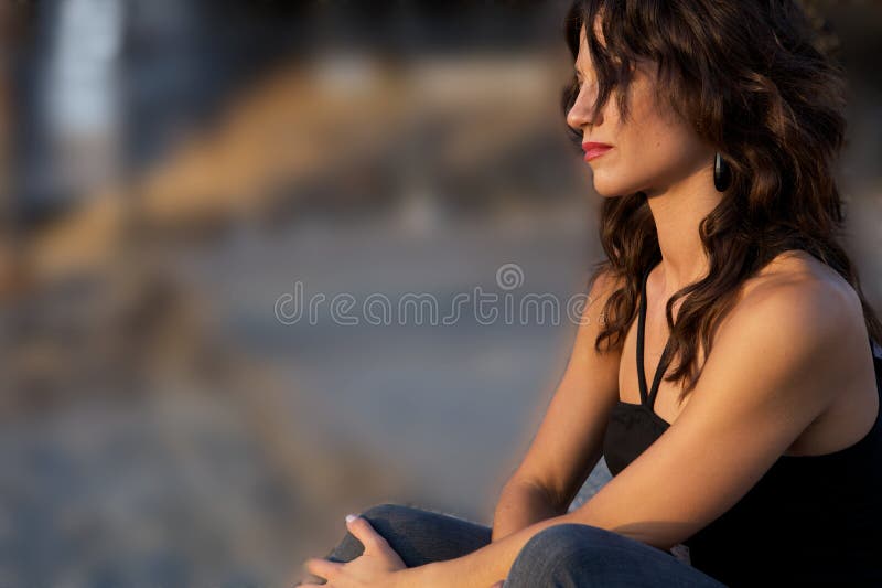 Young Sad Woman Sitting by Herself Stock Image - Image of brunette ...