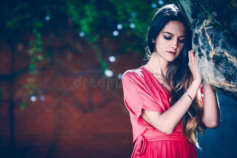 Young Sad Woman Standing Alone, Leaning on a Tree at Park Stock Photo ...