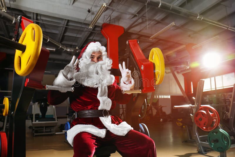 Young Santa Claus Training in Gym Stock Photo - Image of indoors ...