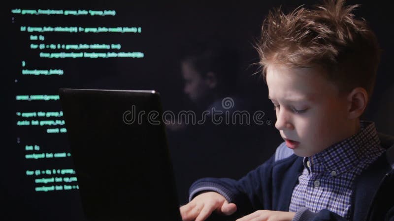 Young Schoolboy Prodigy - a Hacker. Hacker at Work. Lots of Digits on ...