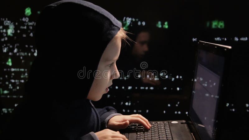 Young Schoolboy Prodigy - a Hacker. Hacker at Work. Lots of Digits on ...