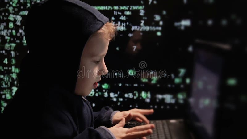 Young Schoolboy Prodigy - a Hacker. Hacker at Work. Lots of Digits on ...