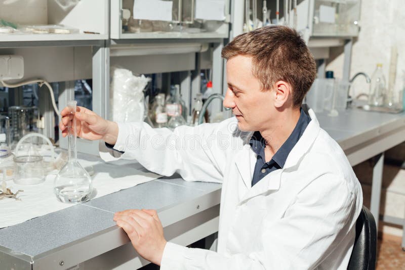 Young Scientist Conducts Chemical Experiments with Liquids in Science ...