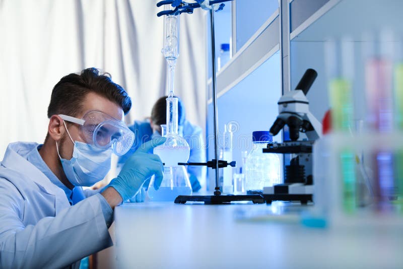 Young Scientist Doing Research and Analysis in Laboratory Stock Photo ...