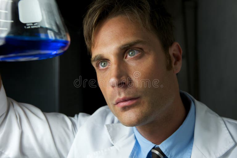 Young Scientist Performing Experiment Stock Image - Image of male ...
