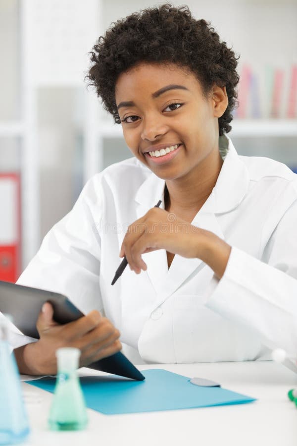 Young Scientist Taking Note on Tablet Smile Stock Image - Image of ...