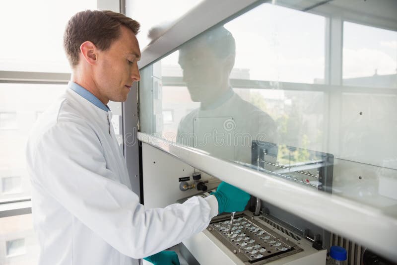 Young Scientist Using a Pipette in Chamber Stock Image - Image of male ...