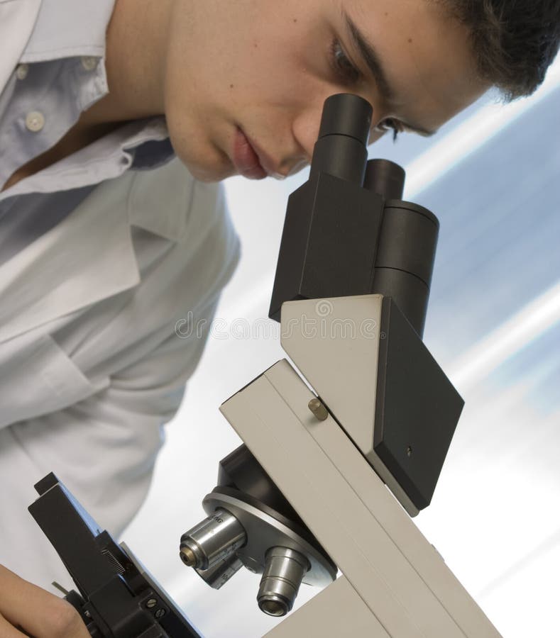 Young Scientist Watching Inside a Microscope Stock Photo - Image of ...