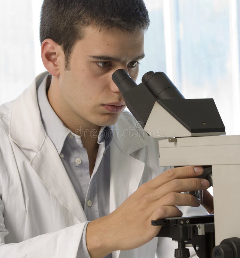 Young Scientist Watching Inside a Microscope Stock Image - Image of ...