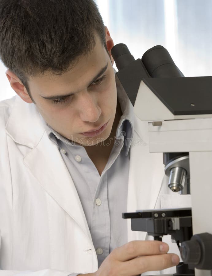 Young Scientist Watching Inside a Microscope Stock Photo - Image of ...
