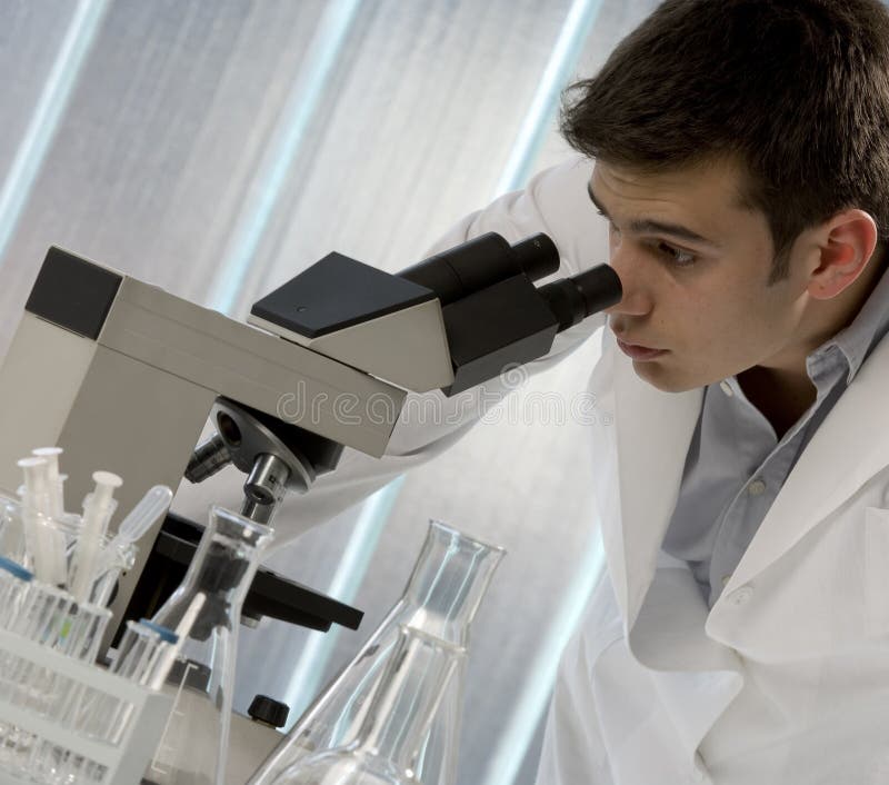 Young Scientist Watching Inside a Microscope Stock Image - Image of ...
