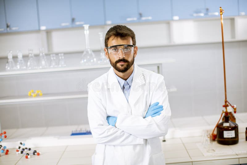 Young Scientist in White Lab Coat Standing in the Biomedical Lab Stock ...