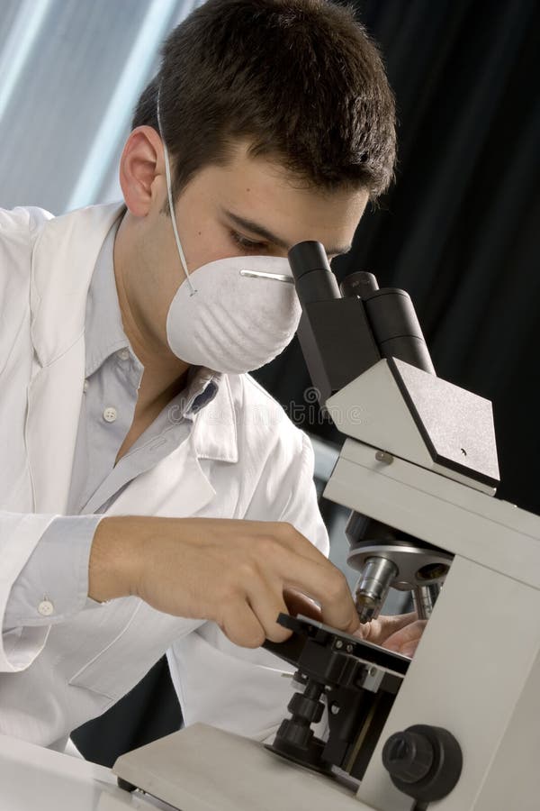 Young Scientist Working at the Microscope Stock Photo - Image of ...
