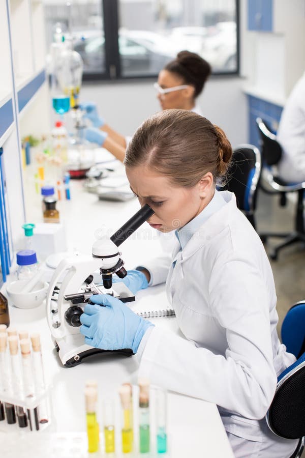 Young Scientist Working with Microscope in Research Laboratory Stock Photo - Image of laboratory ...