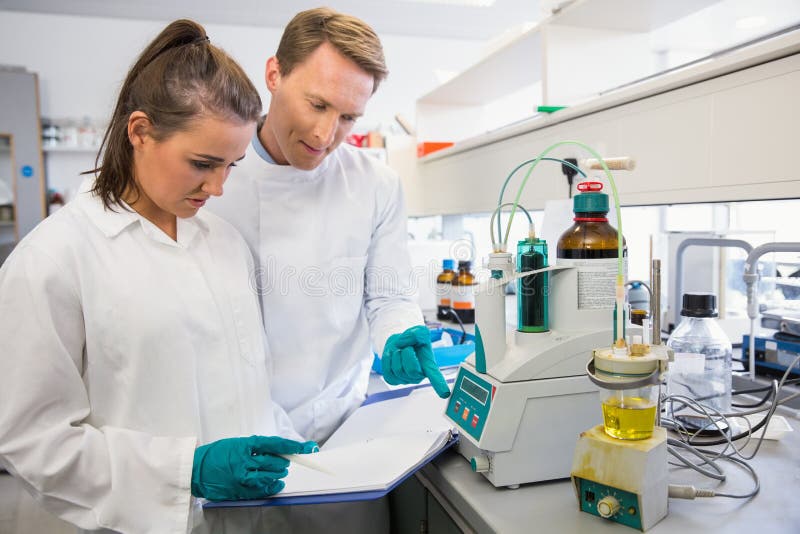 Two Young Scientists Making An Experiment Stock Photo - Image of ...