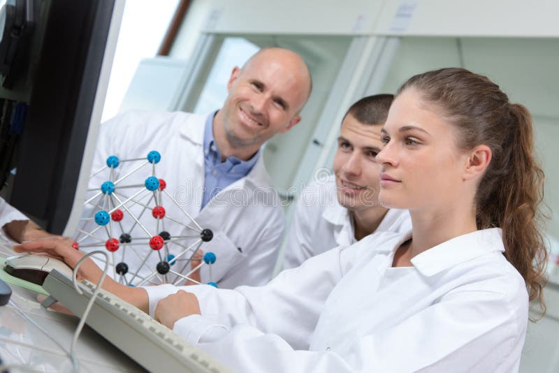 Young Scientists with Dna Model in Laboratory Stock Photo - Image of ...