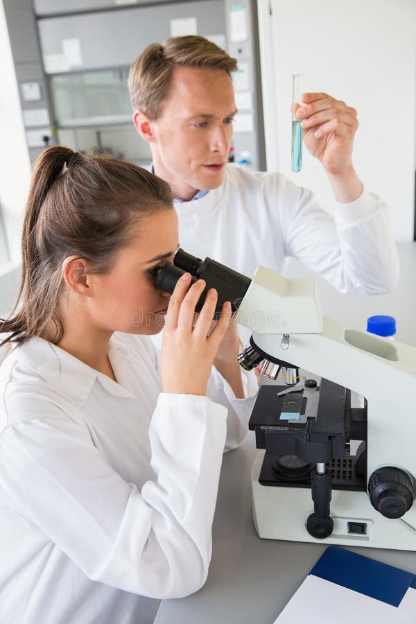 Two Young Scientists Making an Experiment Stock Photo - Image of ...