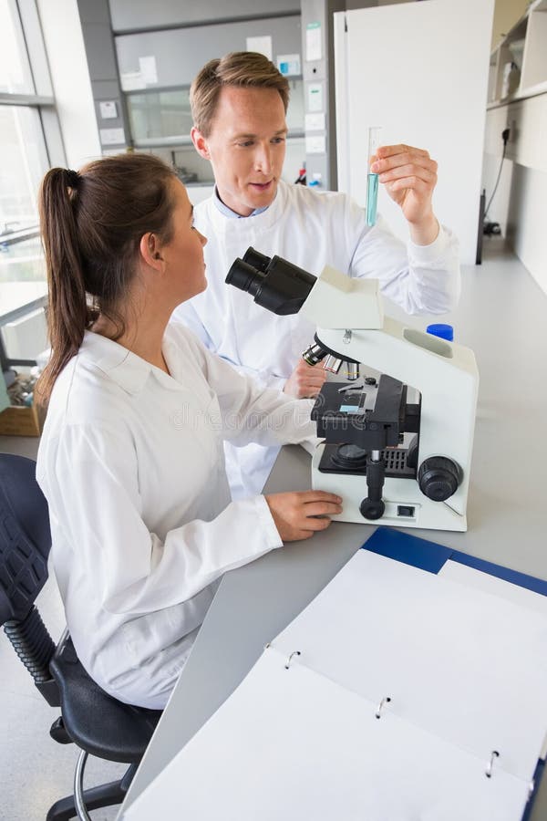 Two Young Scientists Making an Experiment Stock Photo - Image of ...