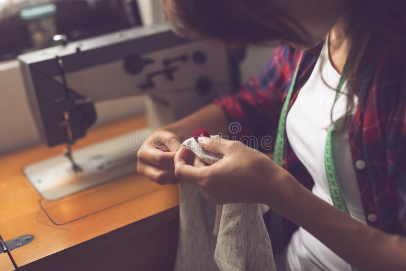 Stitching up a button stock photo. Image of meter, machine - 100259186