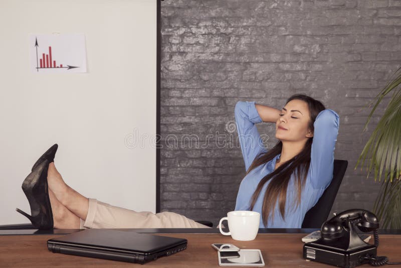 A Young Secretary Enjoys a Free Moment, Rest at Work Stock Photo ...