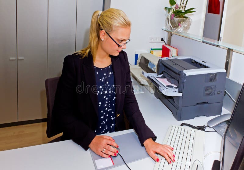 Young Secretary in a Office Stock Photo - Image of concentration ...