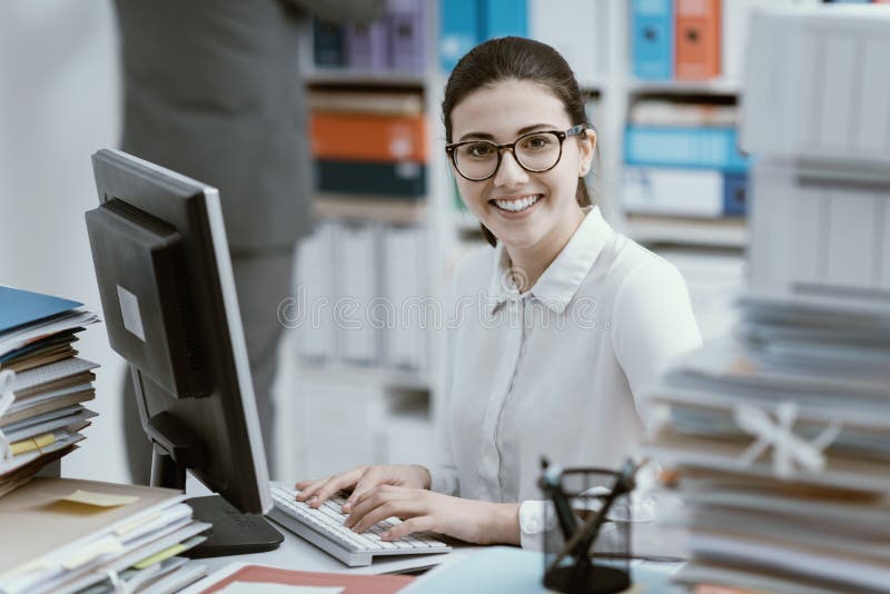 Young Secretary Working and Smiling Stock Photo - Image of glasses ...