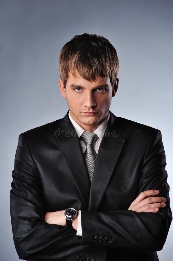 Young serious businessman stock image. Image of person - 12970397