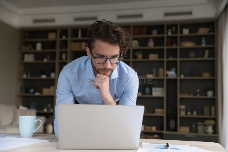 Focused Young Businessman Working at Laptop Computer Stock Image ...