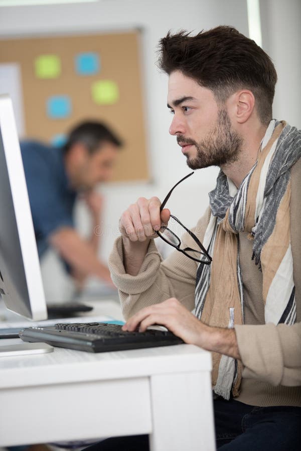 Young Serious Caucasian Architect Sitting in Office Using Computer ...