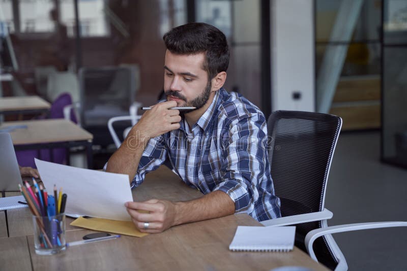 Young Serious Caucasian Businessman or Male Office Worker Analyzing ...