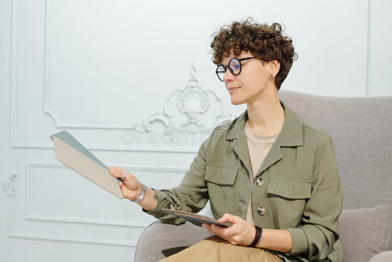 Young Serious Female Client of Studio of Interior Design Looking ...