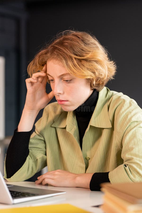 Young Serious Female Developer of Software Looking through Online ...