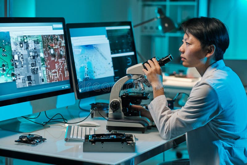 Young Serious Female Scientist Looking at Computer Screen Stock Image ...