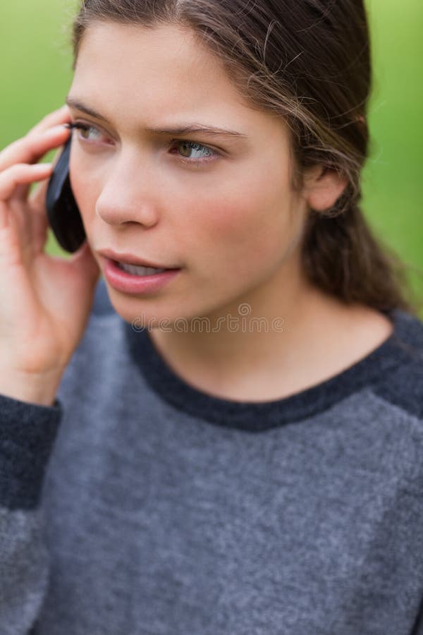 Young Serious Girl Talking on the Phone Stock Photo - Image of speaking ...