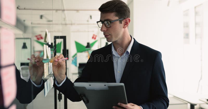 Employee Writing on Sticky Notes on Board Stock Footage - Video of ...