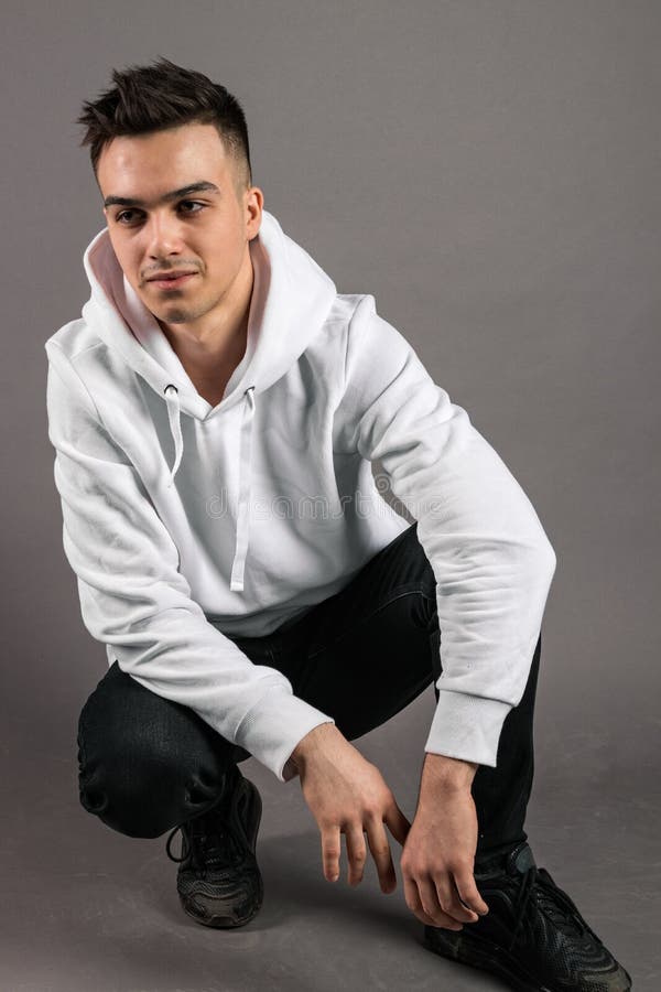 Young Serious Man Posing in Studio. Gray Background Stock Image - Image ...