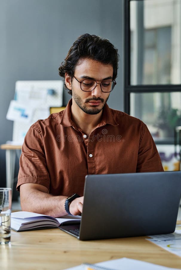 Young Serious Manager or Designer Networking by Desk Stock Image ...