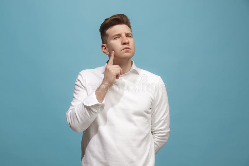Young Serious Thoughtful Businessman. Doubt Concept. Stock Photo ...
