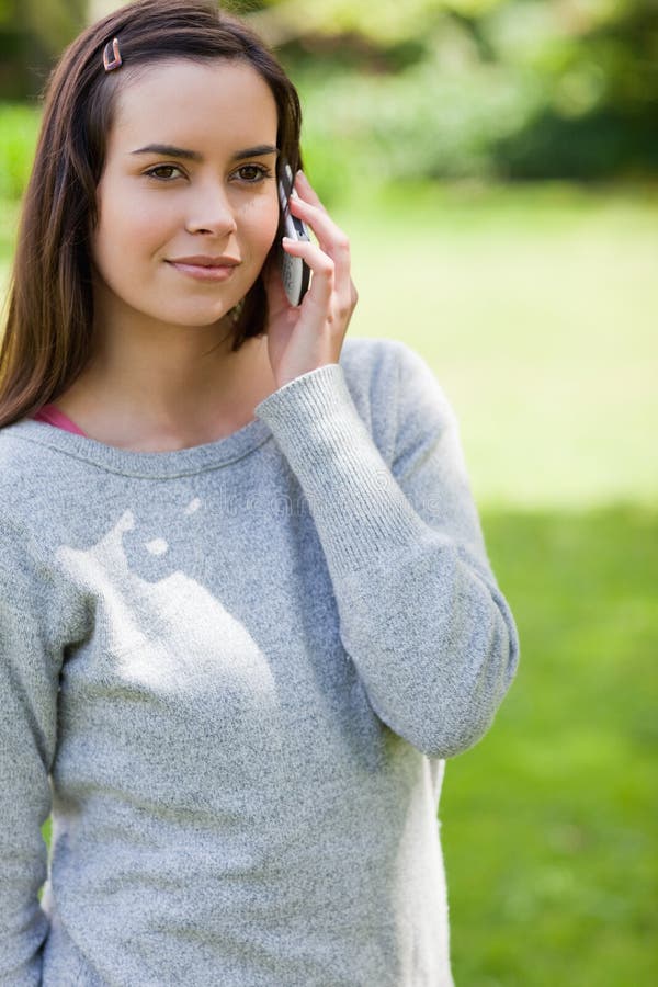 Young Serious Woman Calling on Her Cellphone Stock Photo - Image of ...