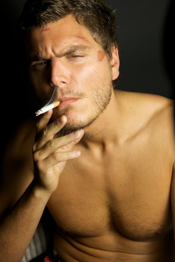 Young Man Smoking a Cigarette Stock Image - Image of portrait, short ...